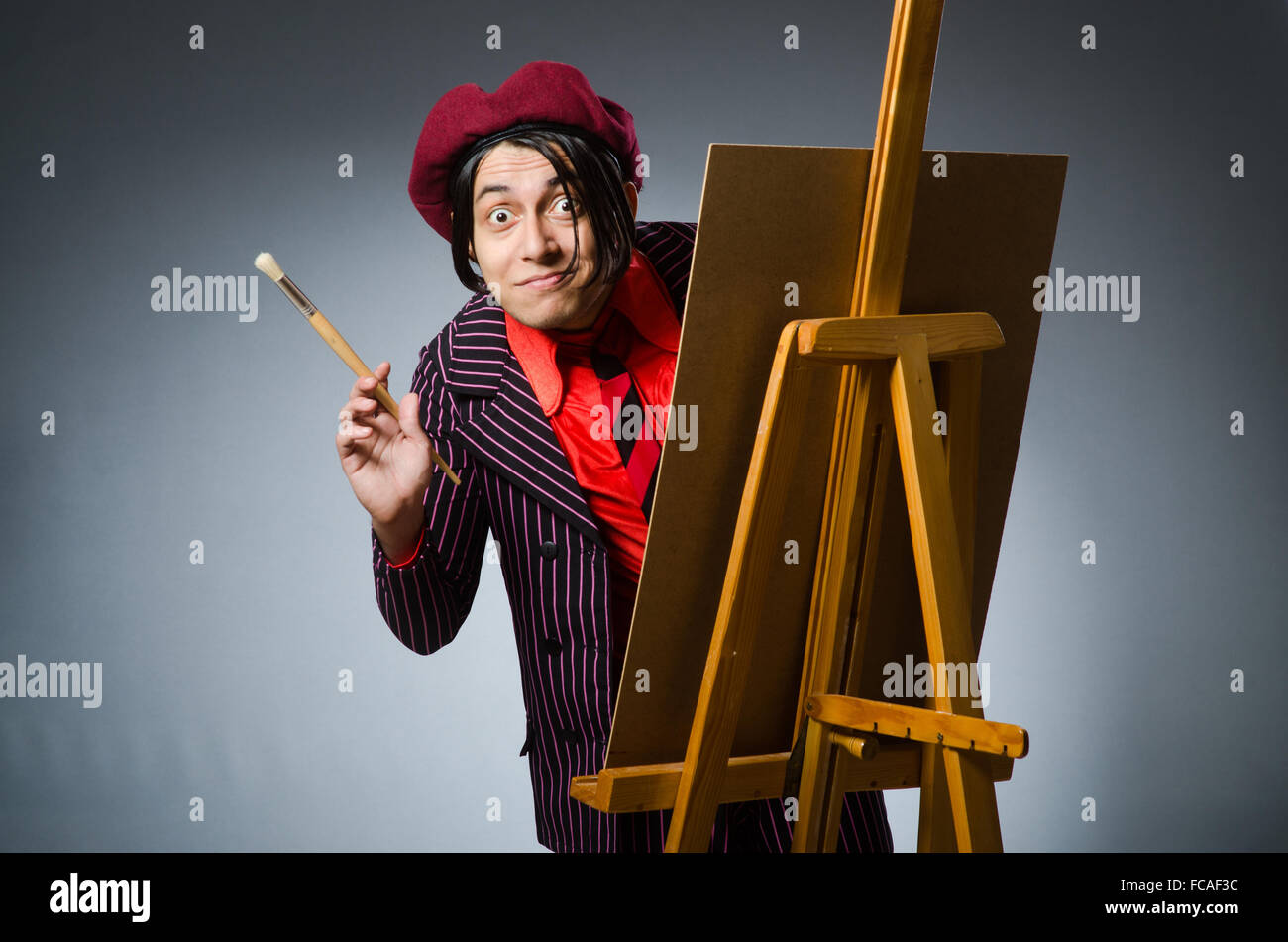 Funny artist with his artwork Stock Photo - Alamy