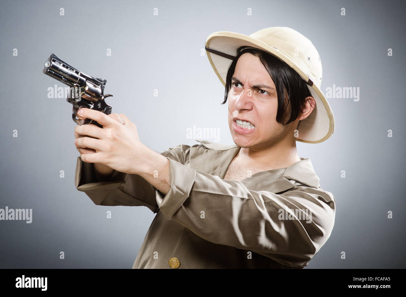 Funny safari traveller in travelling concept Stock Photo - Alamy