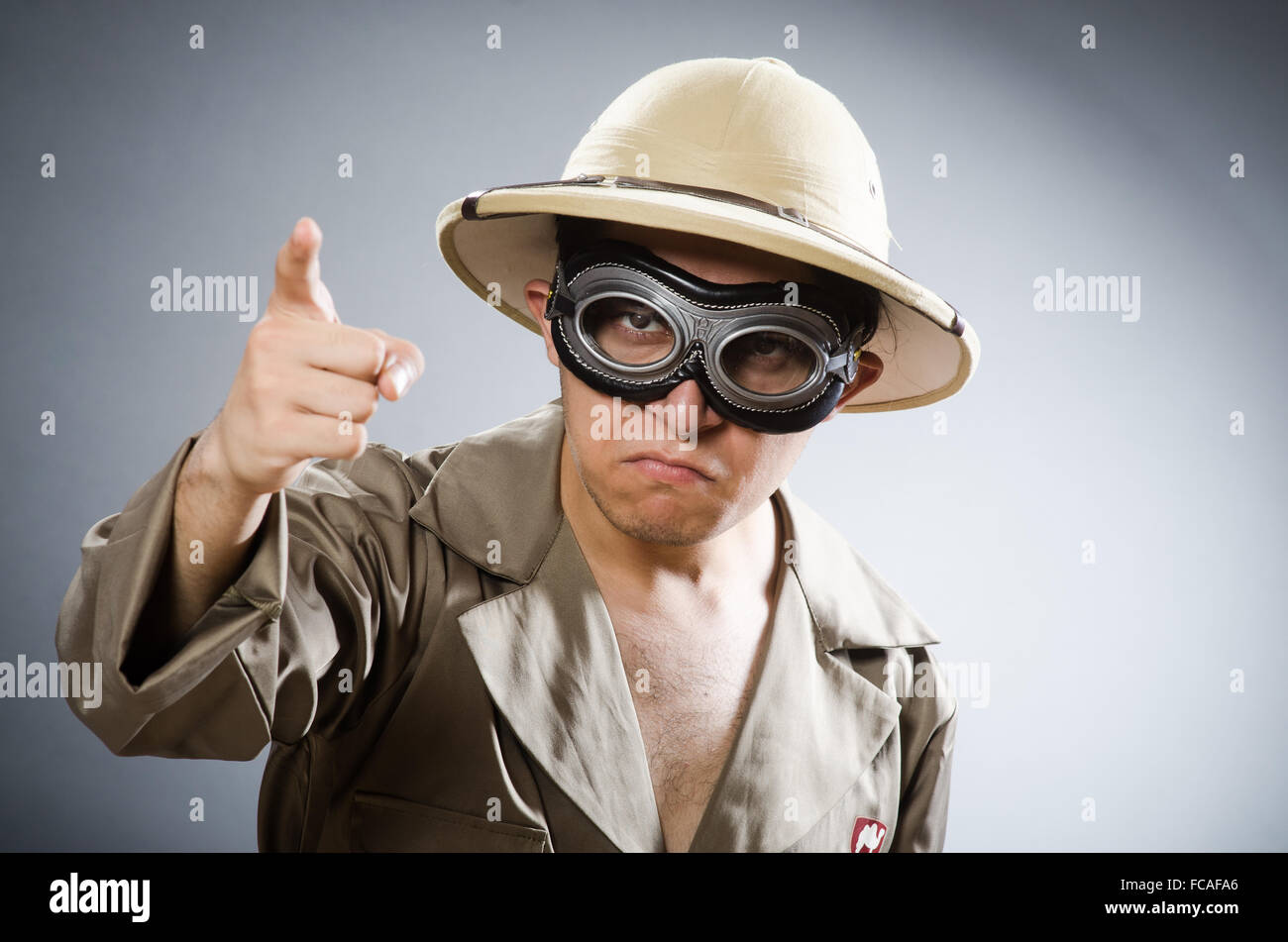 Funny safari traveller in travelling concept Stock Photo - Alamy