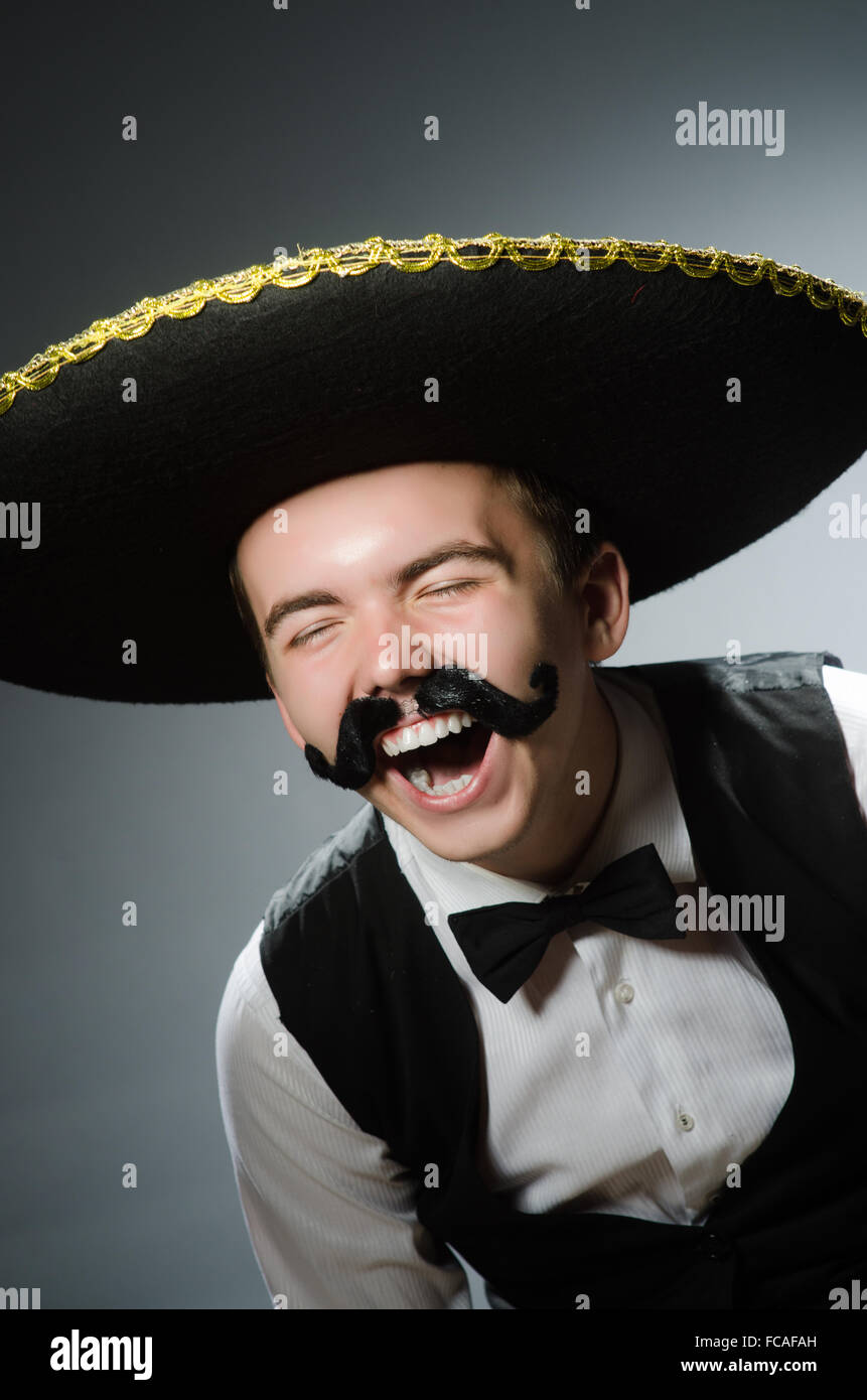 Person wearing sombrero hat in funny concept Stock Photo - Alamy