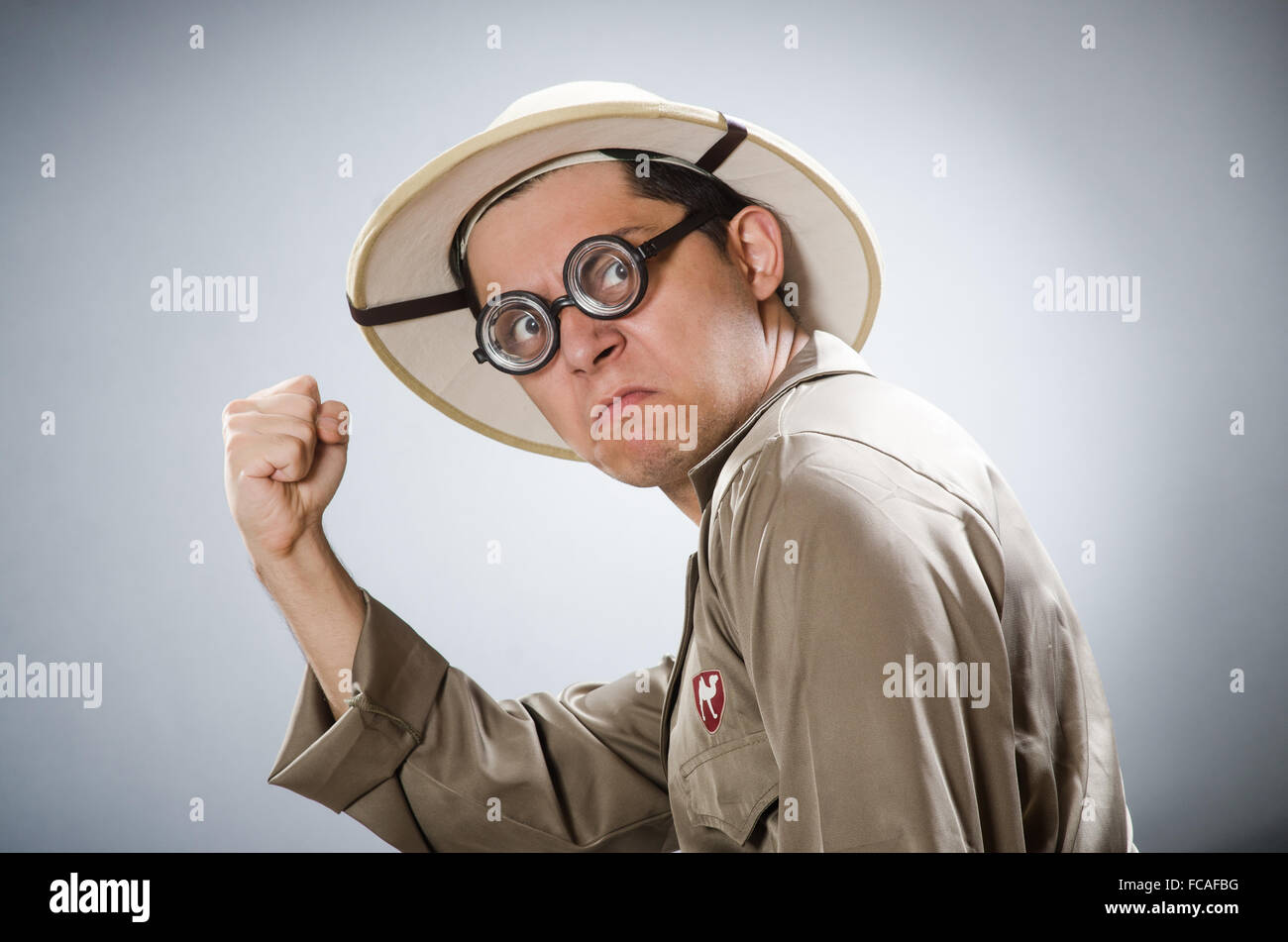 Funny safari traveller in travelling concept Stock Photo - Alamy