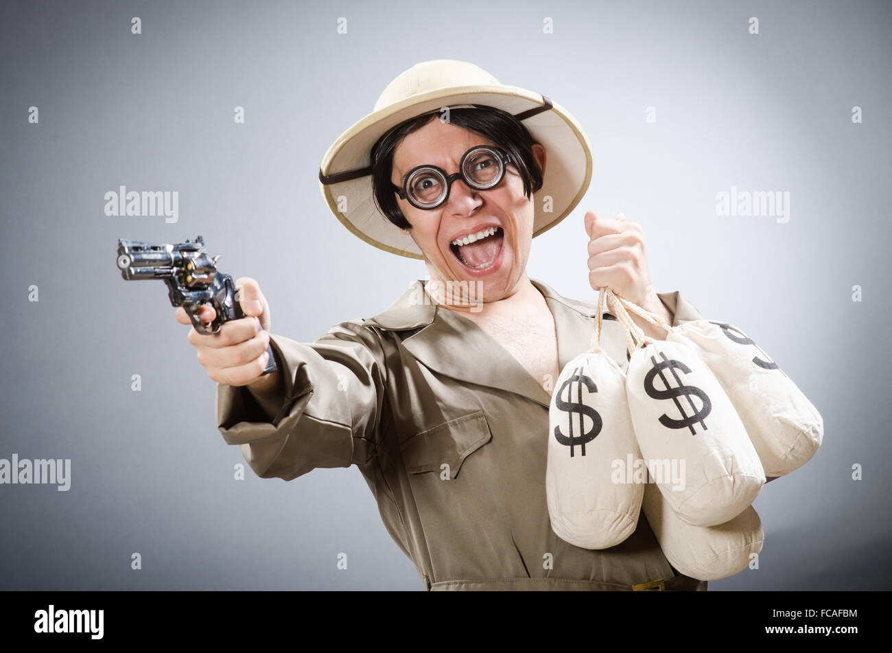 Funny safari traveller in travelling concept Stock Photo - Alamy