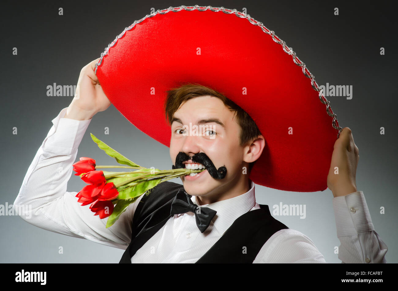 Person wearing sombrero hat in funny concept Stock Photo - Alamy