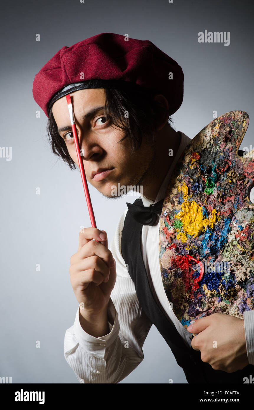 Funny artist in dark studio Stock Photo - Alamy