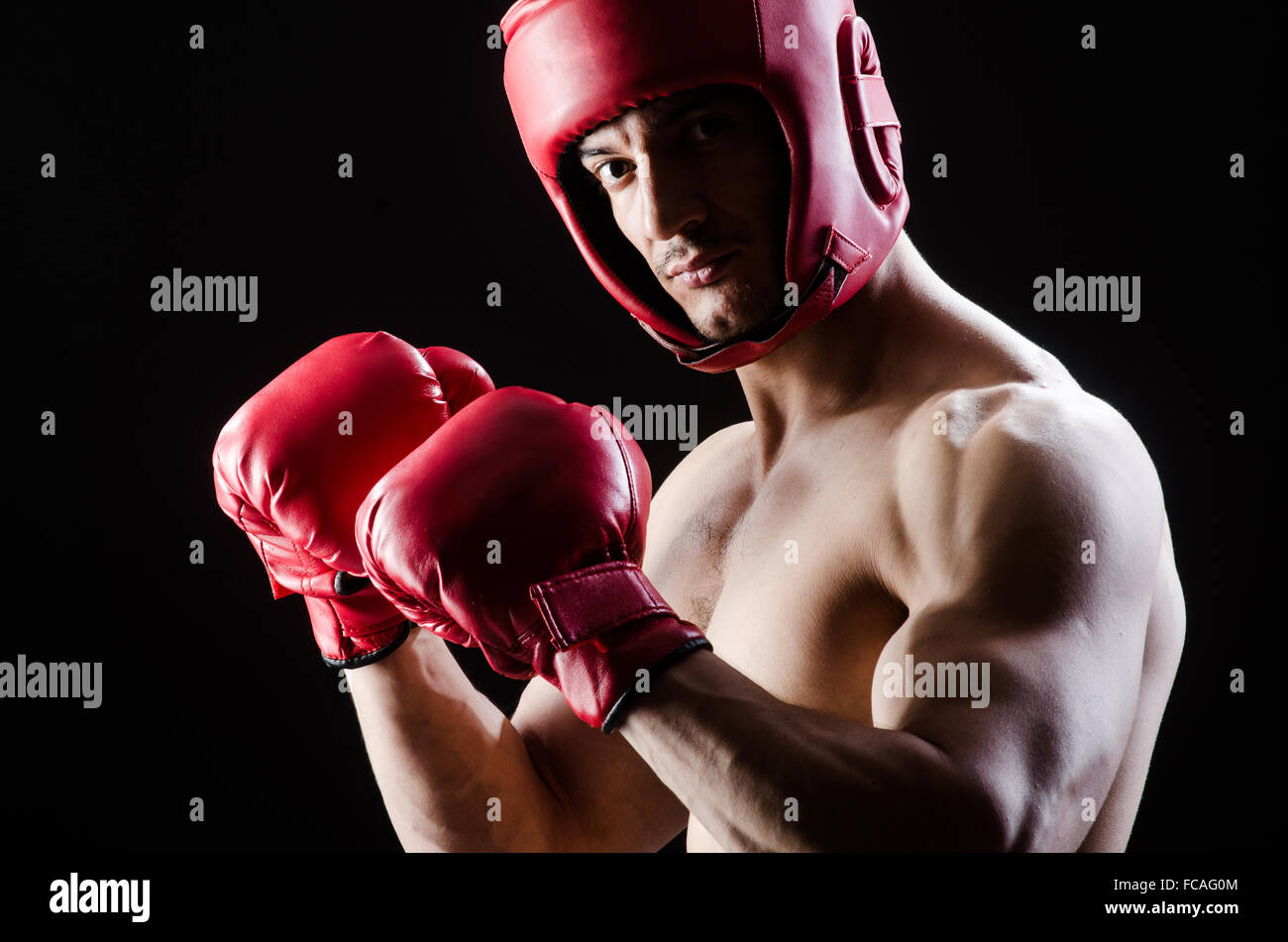 The muscular man in boxing concept Stock Photo - Alamy