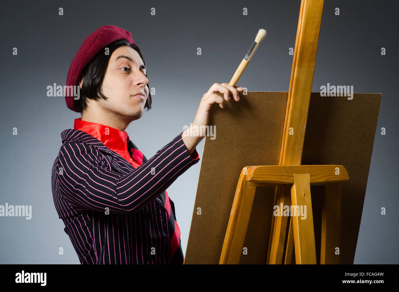 Funny artist with his artwork Stock Photo - Alamy