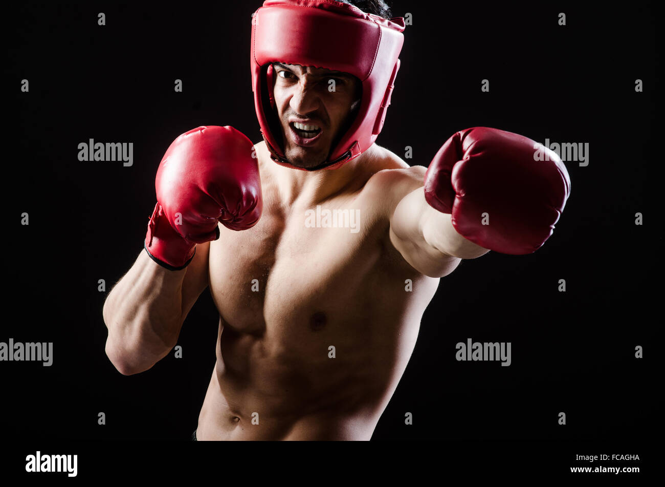 Muscular man in boxing concept Stock Photo - Alamy