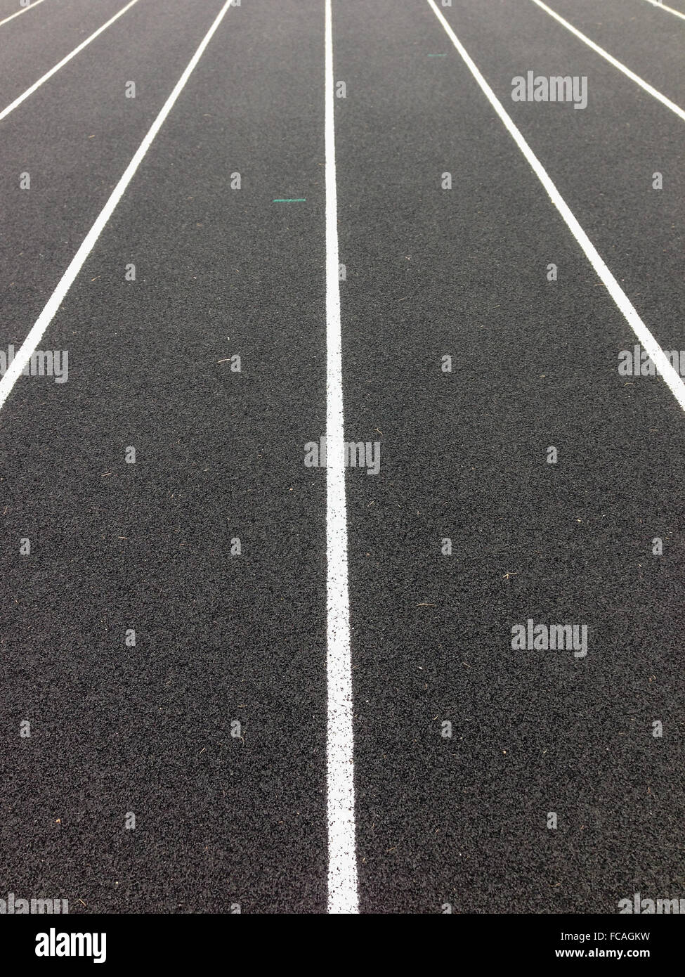 Black track centered on stripe background image Stock Photo - Alamy