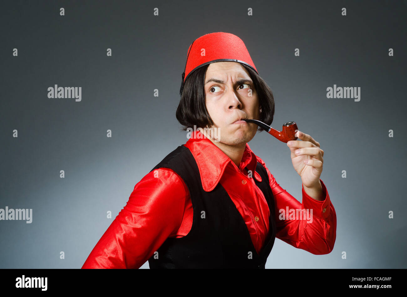 Man wearing fez hat smoking hi-res stock photography and images - Alamy