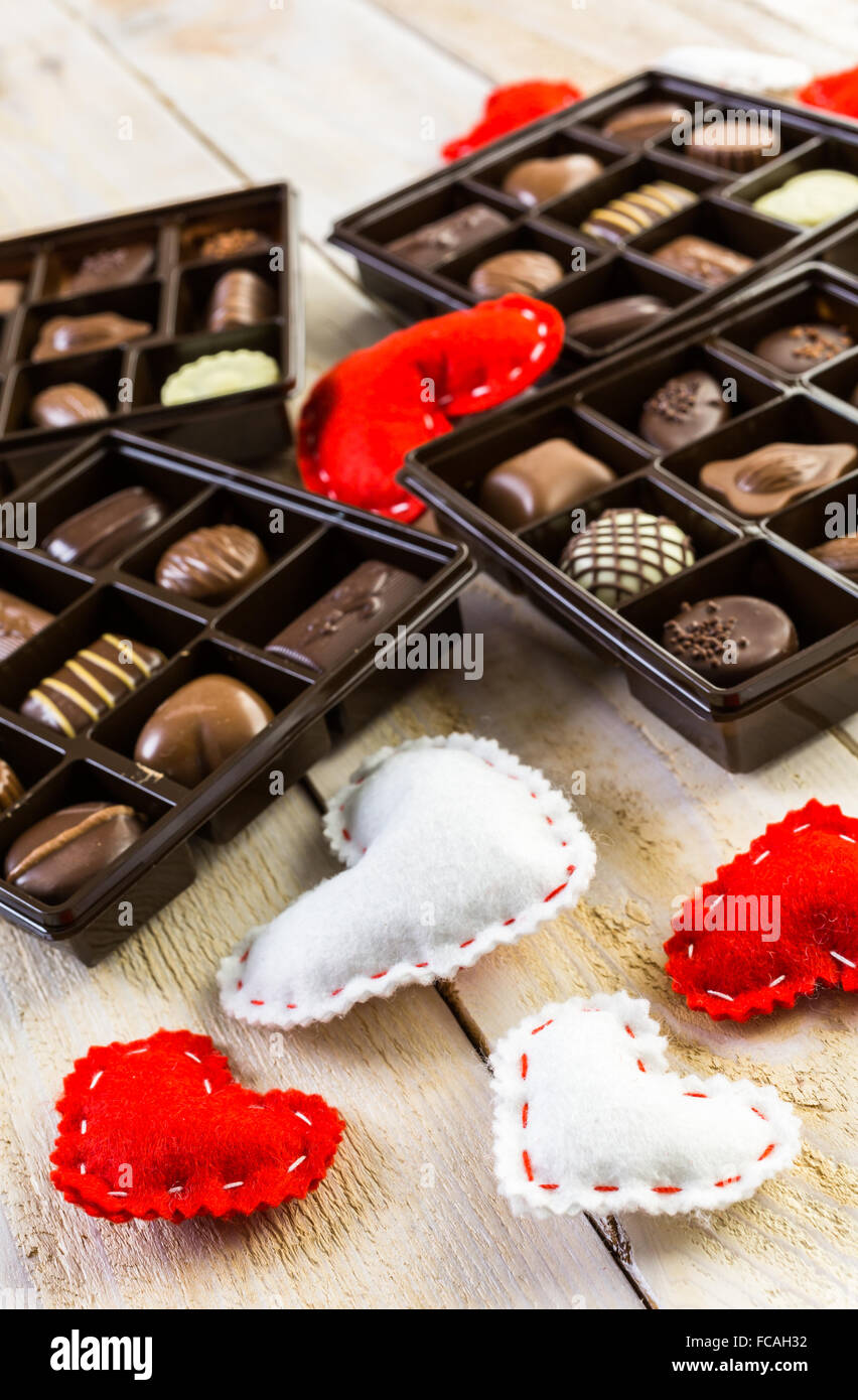 Assorted chocolates on wood table Stock Photo - Alamy