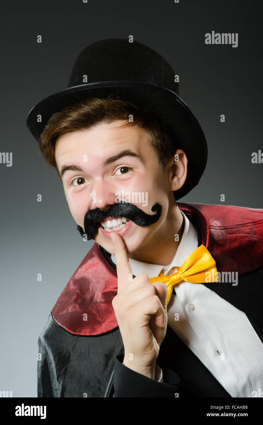 Funny magician man wearing tophat Stock Photo - Alamy
