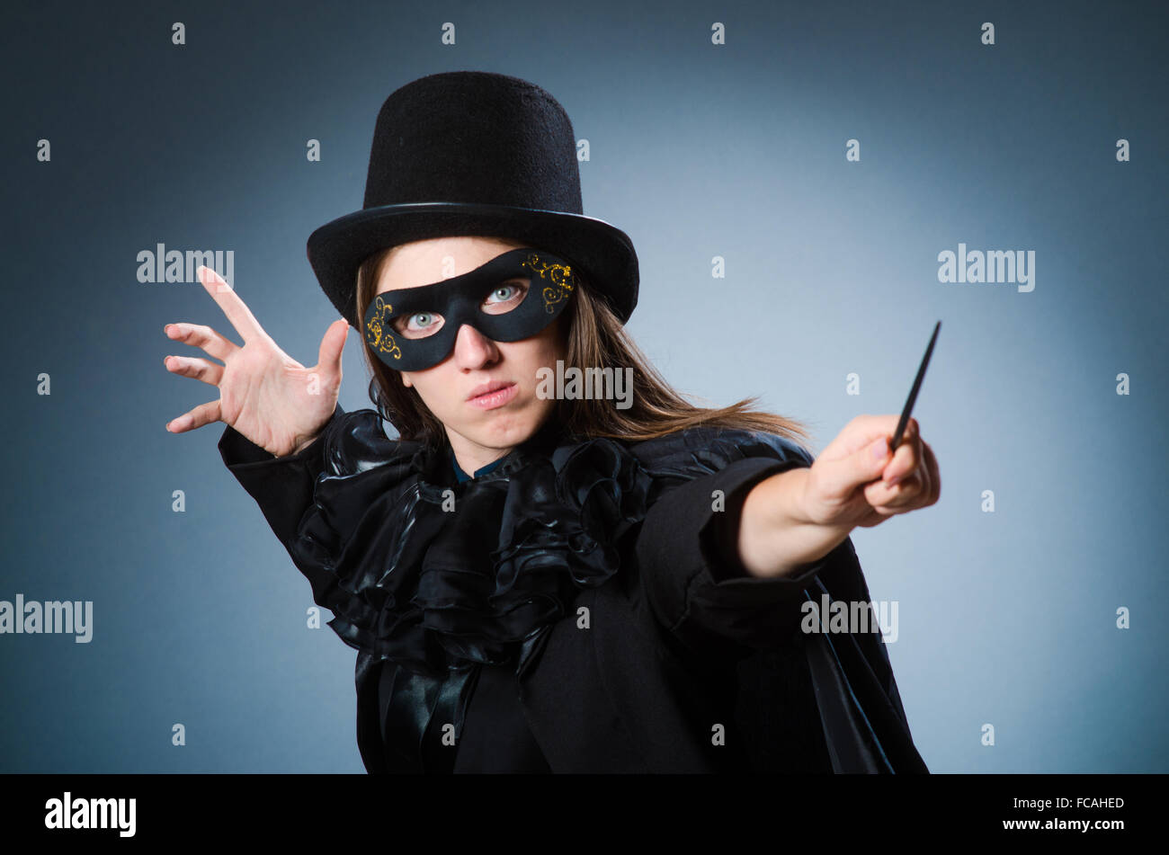 Woman magician in funny concept Stock Photo - Alamy