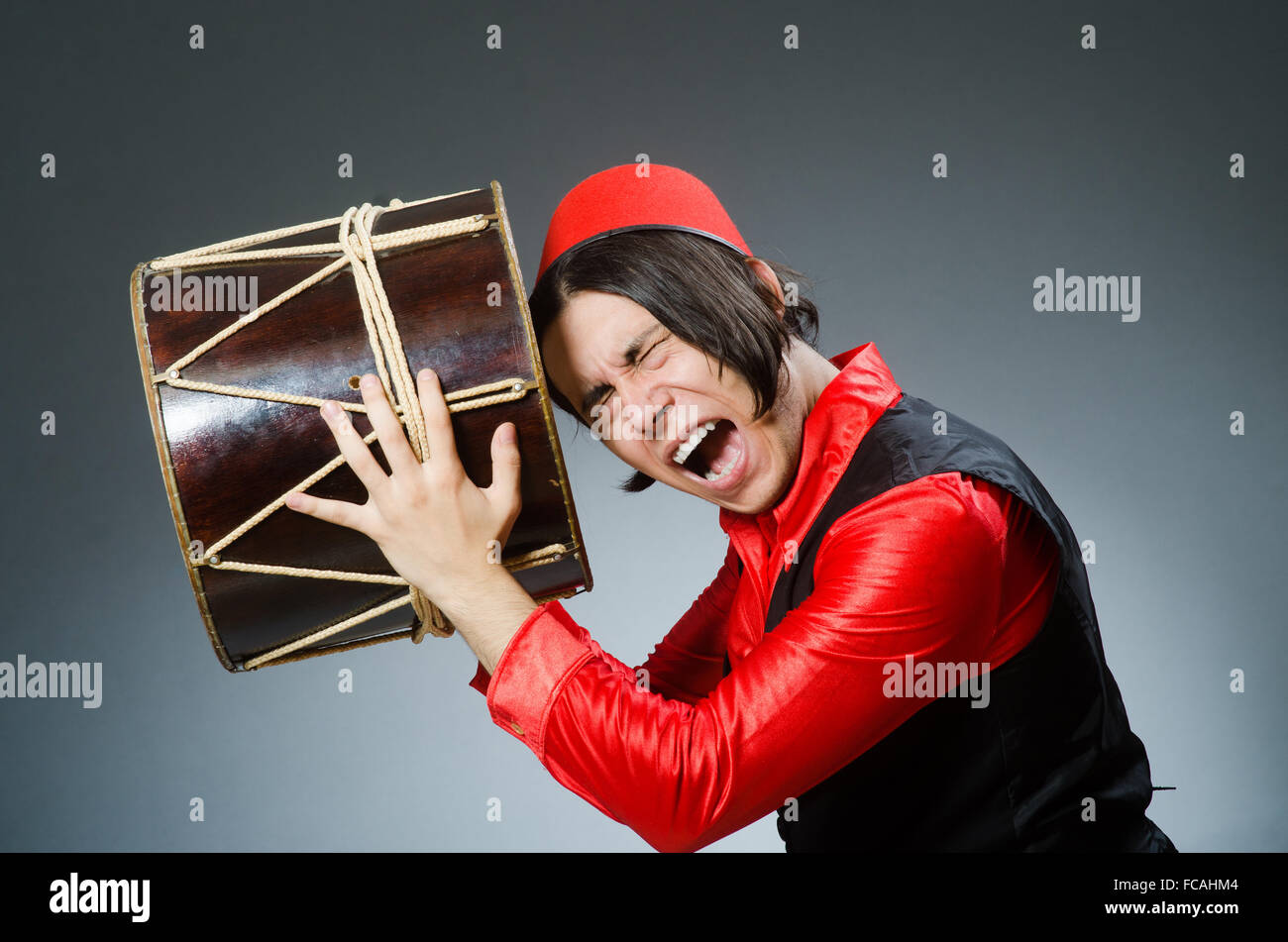 Man wearing red fez hat Stock Photo - Alamy