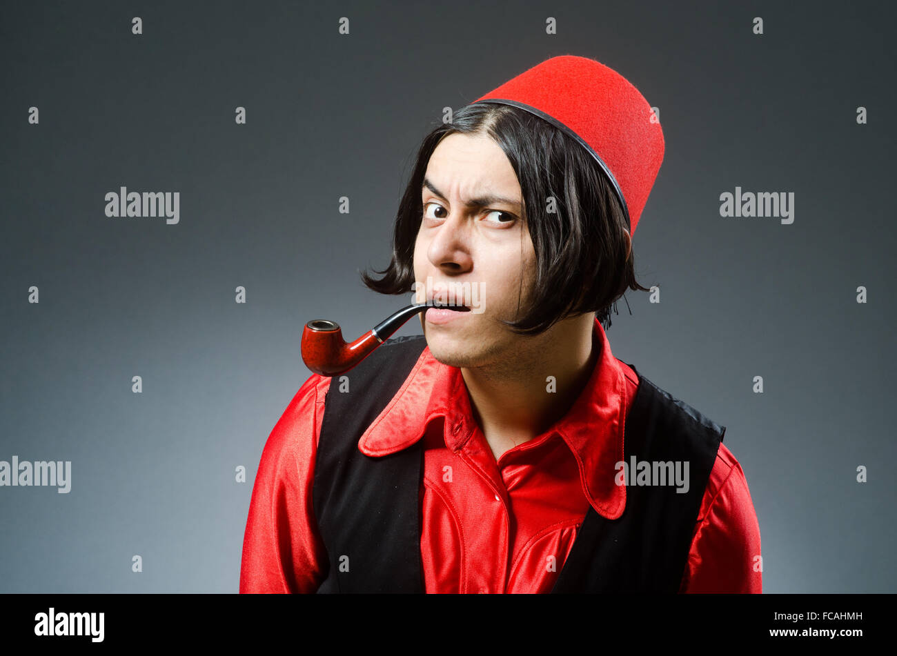 Man wearing red fez hat Stock Photo - Alamy