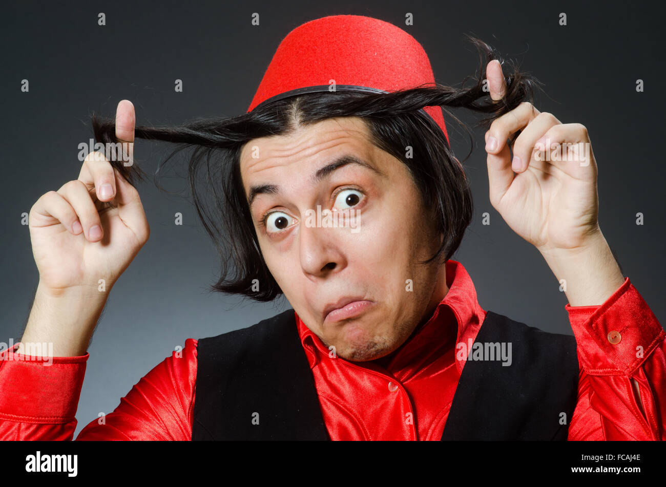 Man wearing red fez hat Stock Photo - Alamy
