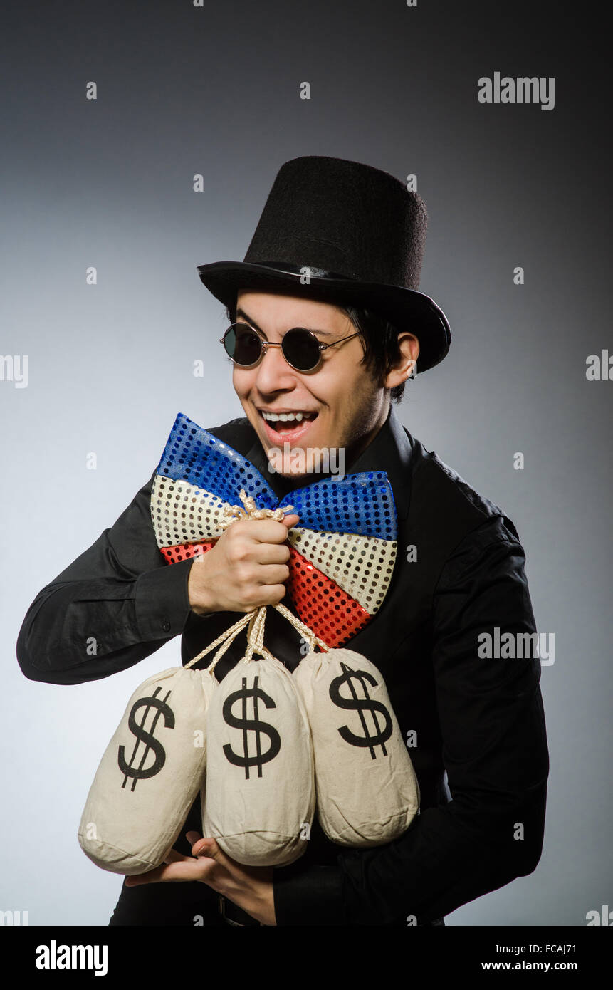 Funny man with money dollar sacks Stock Photo - Alamy