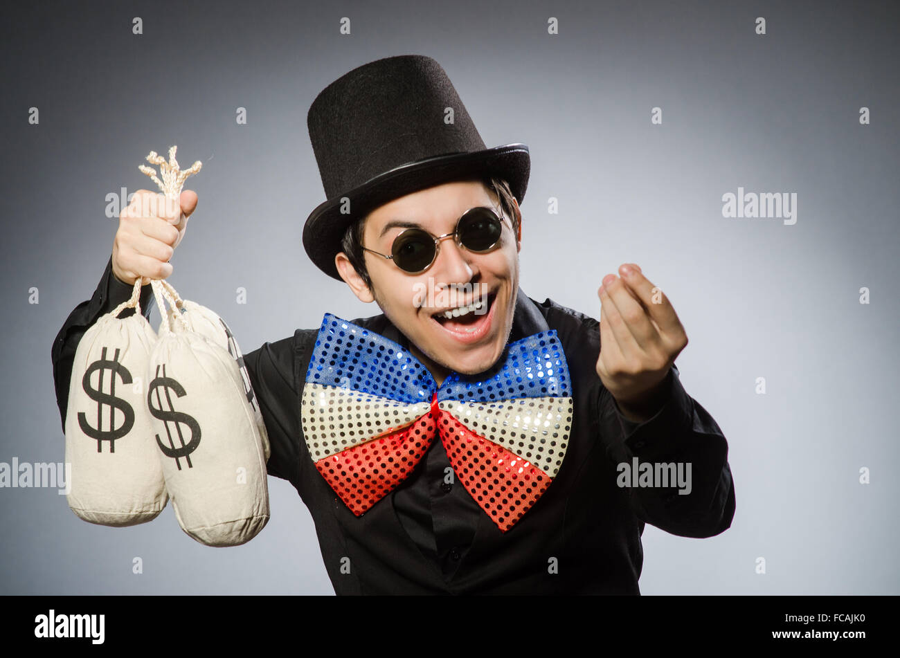 Funny man with money dollar sacks Stock Photo - Alamy