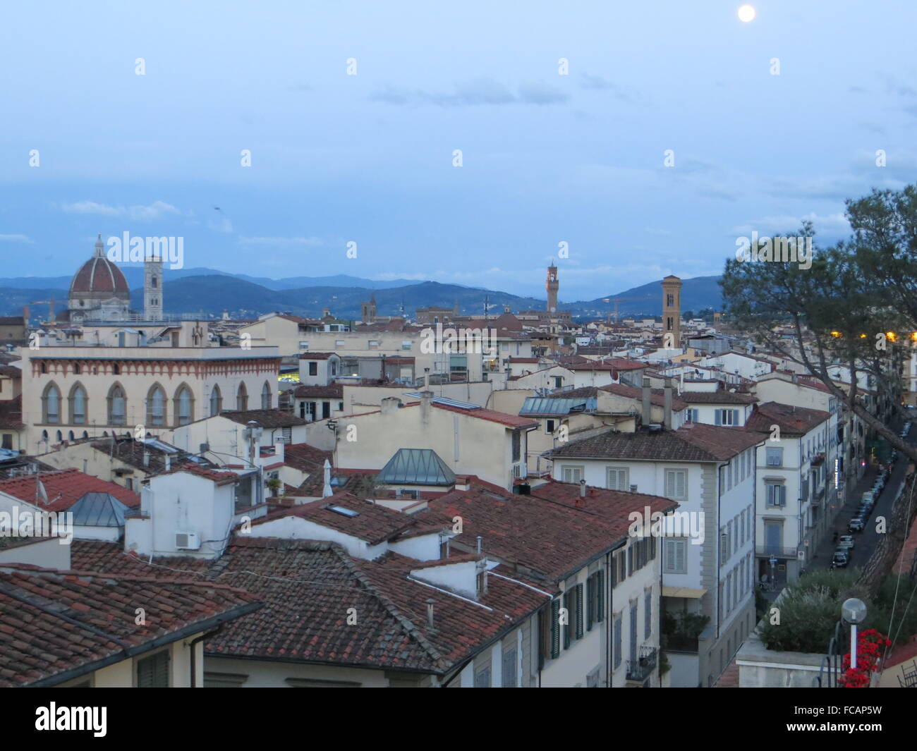The moon over Florence as dusk draws in Stock Photo - Alamy
