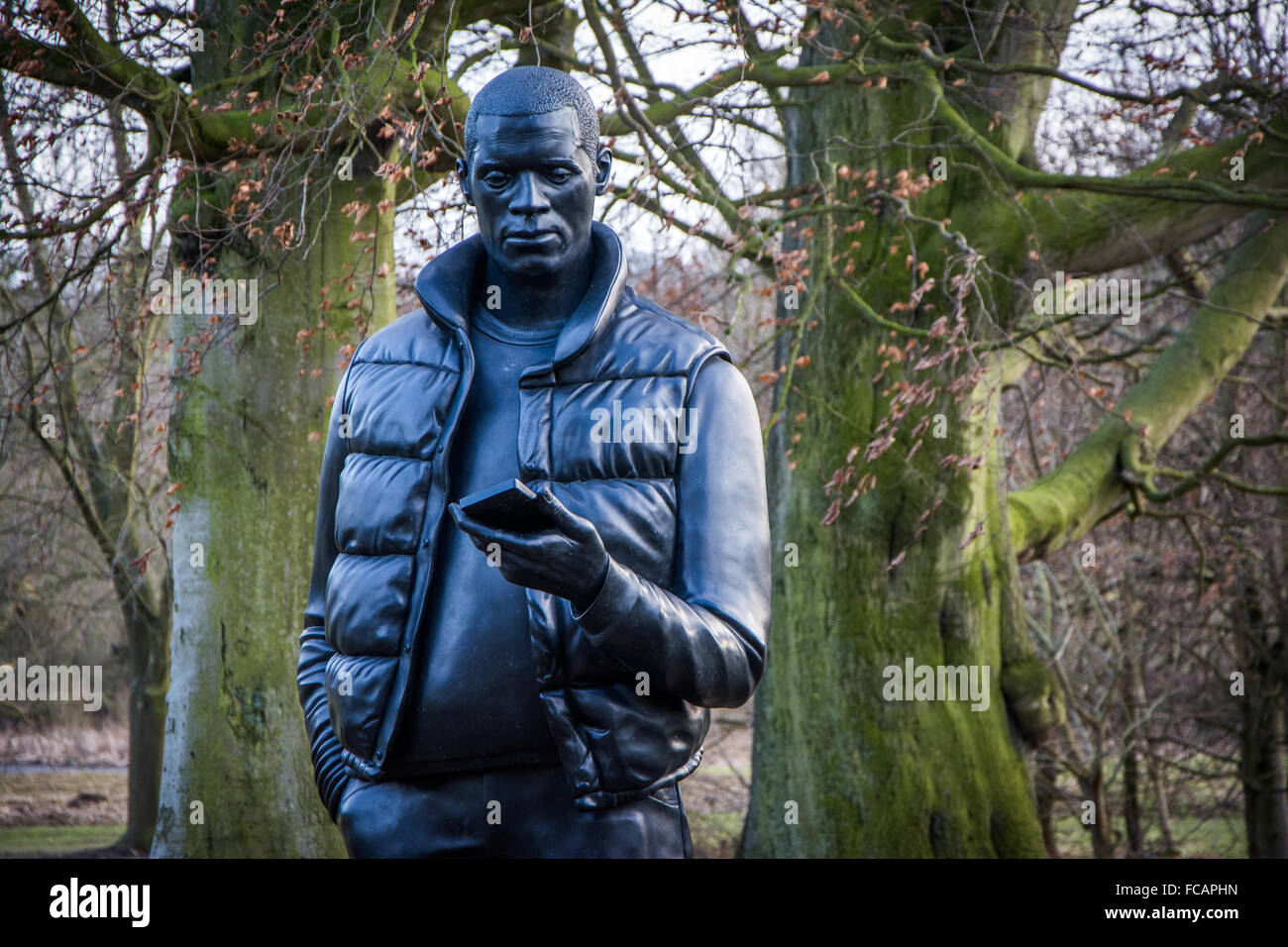 Large man with smart phone sculpture at the Yorkshire Sculpture Park ...