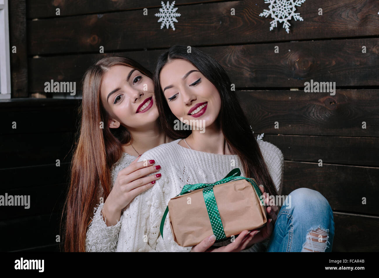 Two beautiful girls at Christmas Stock Photo - Alamy