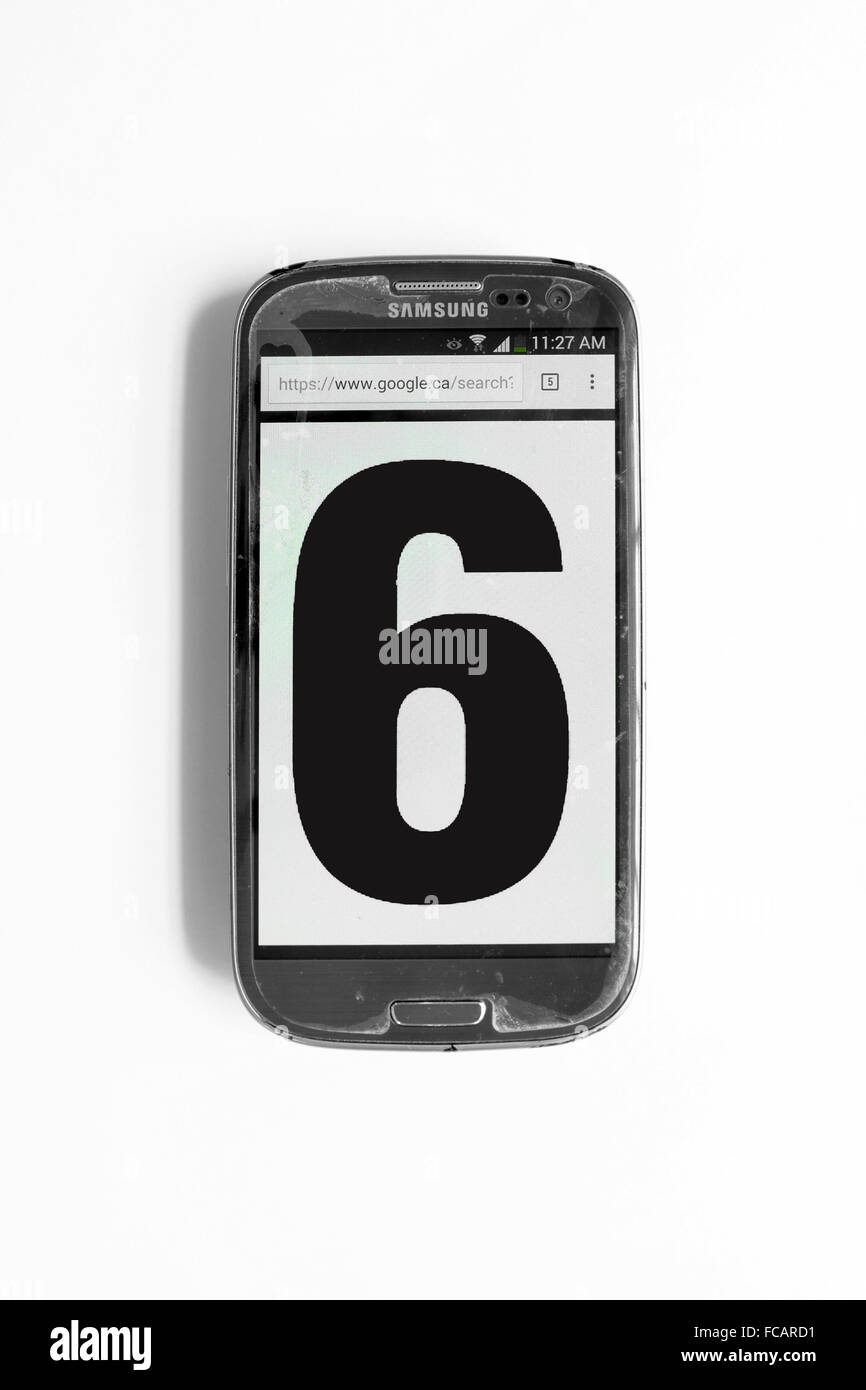 6 on the screen of smartphones photographed against a white background ...