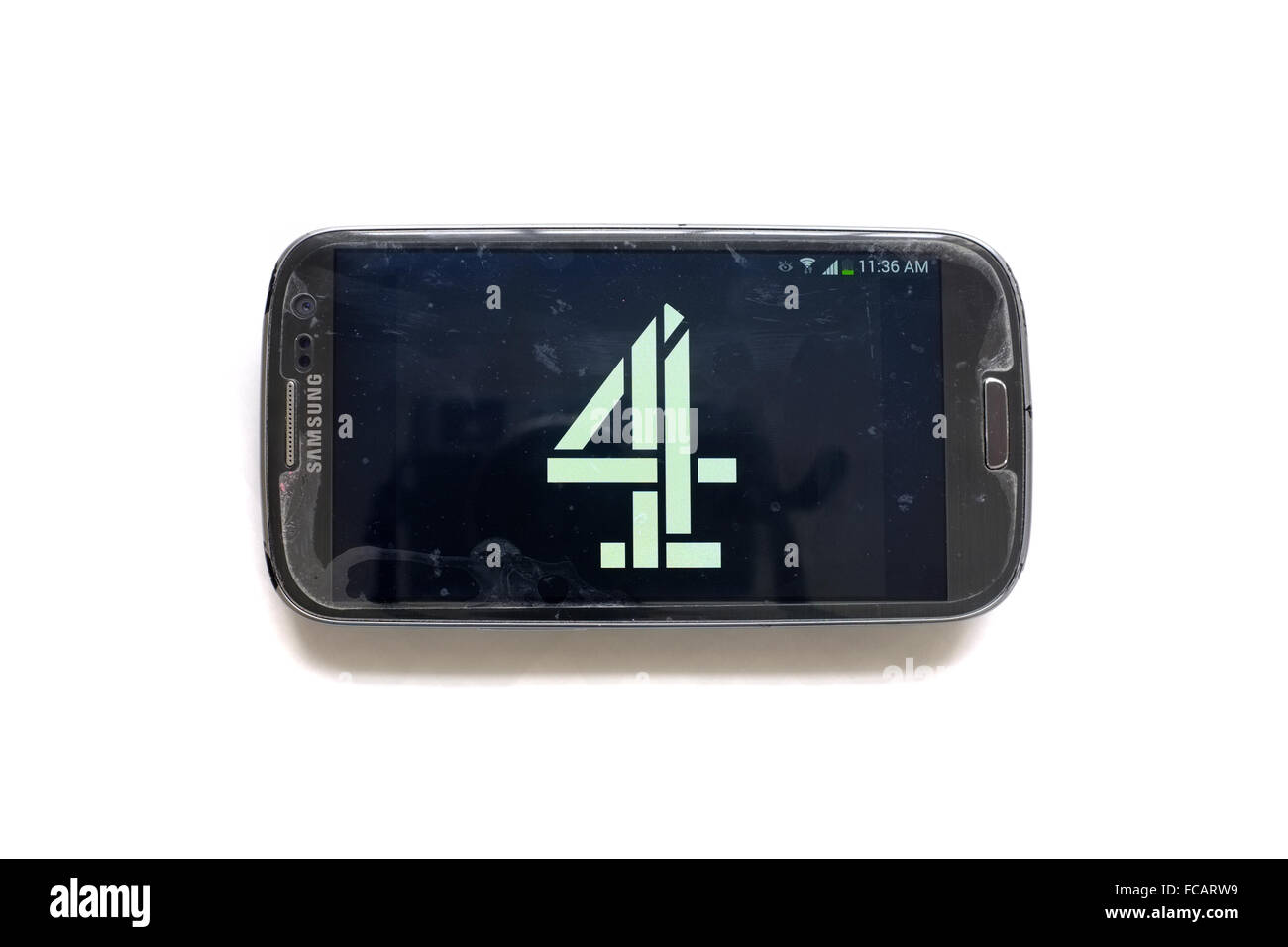 The Channel 4 logo on the screen of smartphone photographed against a ...