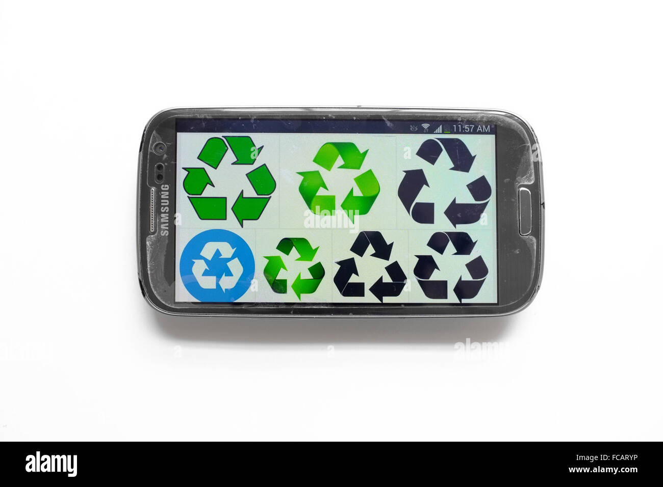 Recycling symbols on the screen of smartphone photographed against a ...