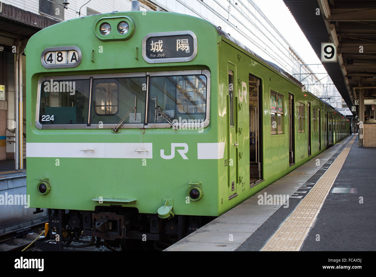 Kyoto, Japan. 1st Nov, 2012. A green Japanese Rail (JR) train waits for ...