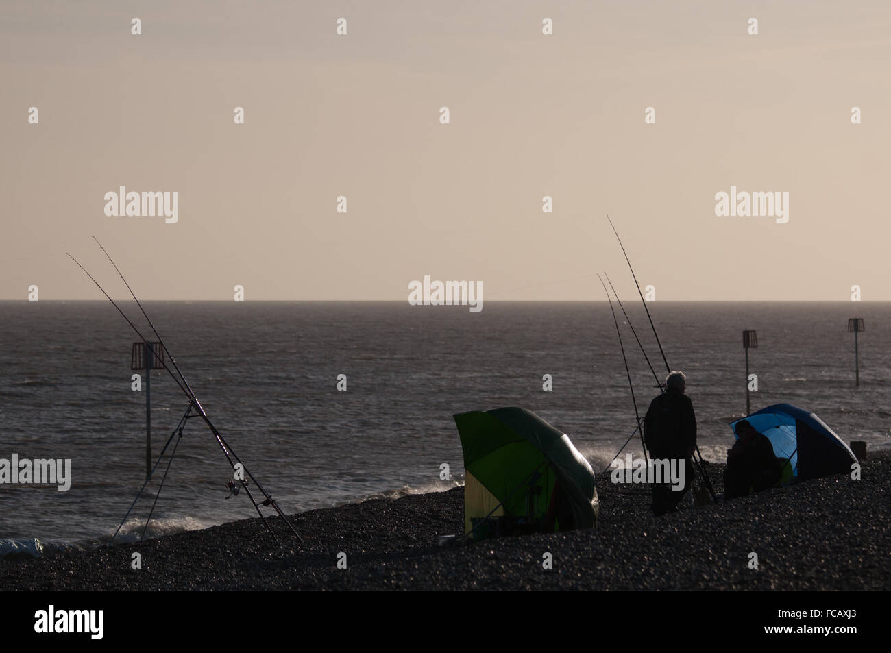 Sea anglers on the beach Stock Photo - Alamy