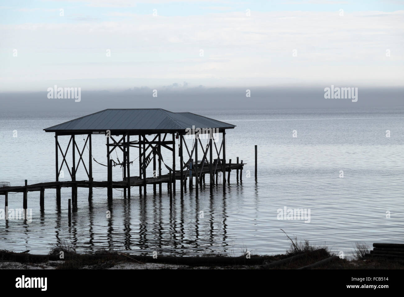 fishing pier and boat house on Mobile Bay in deep south Alabama Stock ...