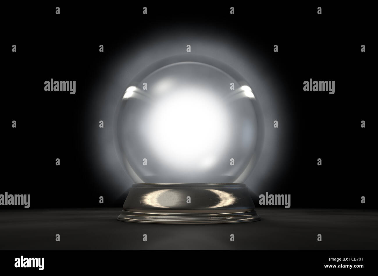 A regular glowing crystal ball on an isolated dark studio background ...