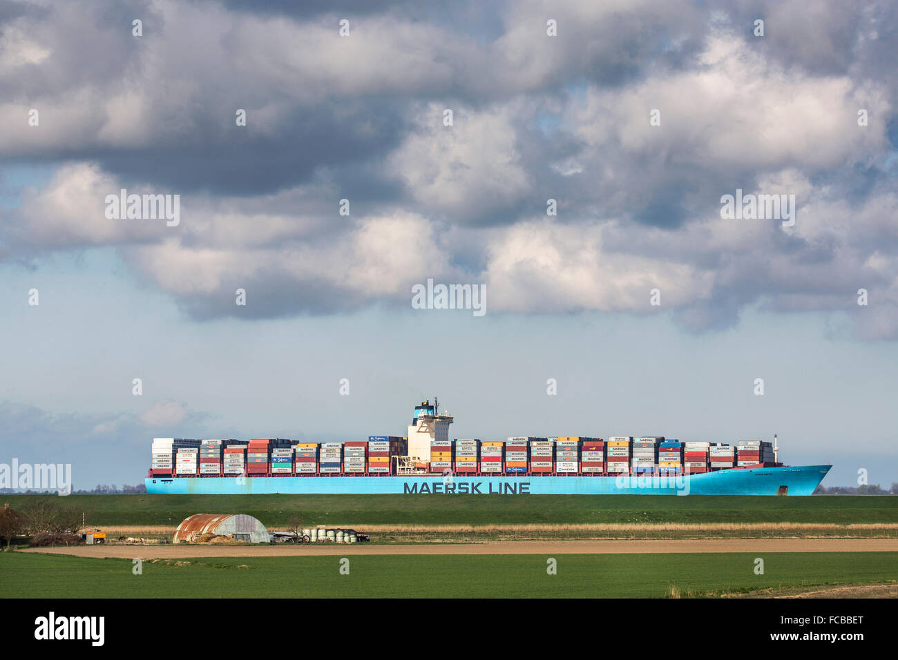 Netherlands, Ossenisse, Westerschelde river. Container ship Stock Photo ...