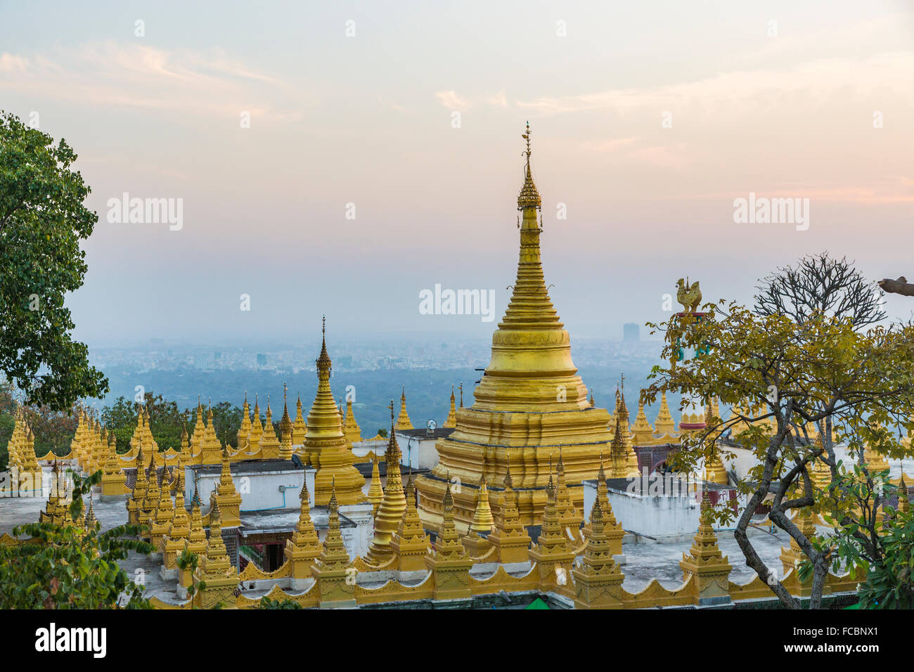 Golden stupas of Sataungpyei Temple at the top of Mandalay Hill pagoda ...