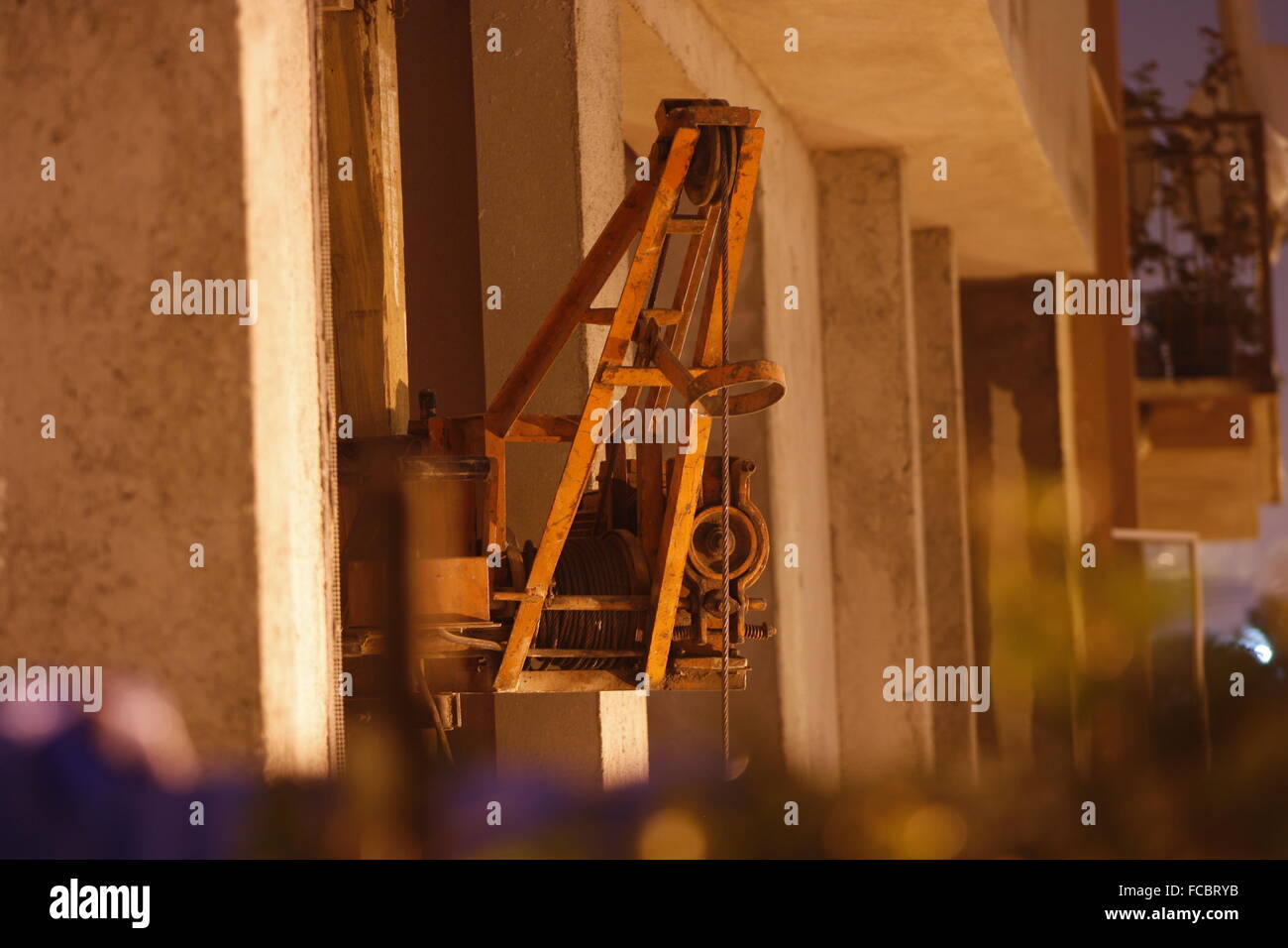 Pulley On Wall At Construction Site Stock Photo - Alamy