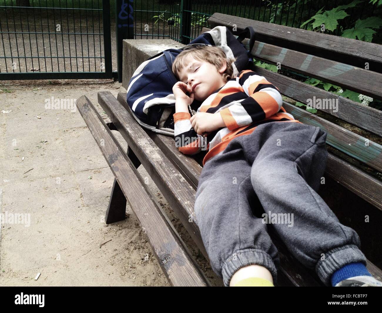 Boy on bench hi-res stock photography and images - Alamy