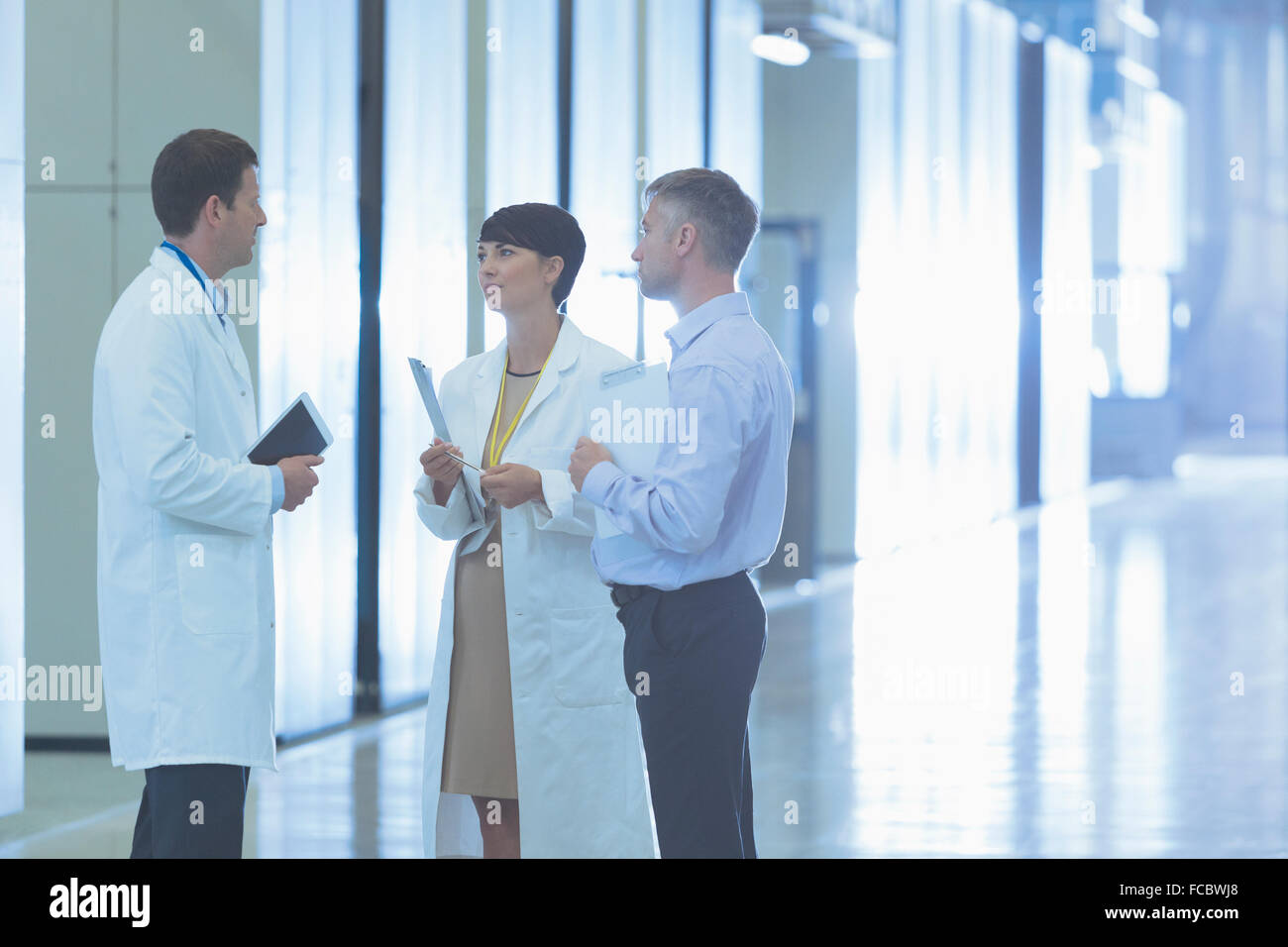 Scientists talking lab hi-res stock photography and images - Alamy