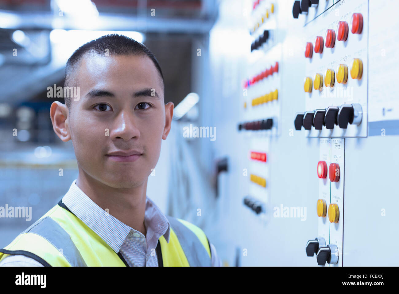 Portrait confident worker at control panel in factory Stock Photo - Alamy
