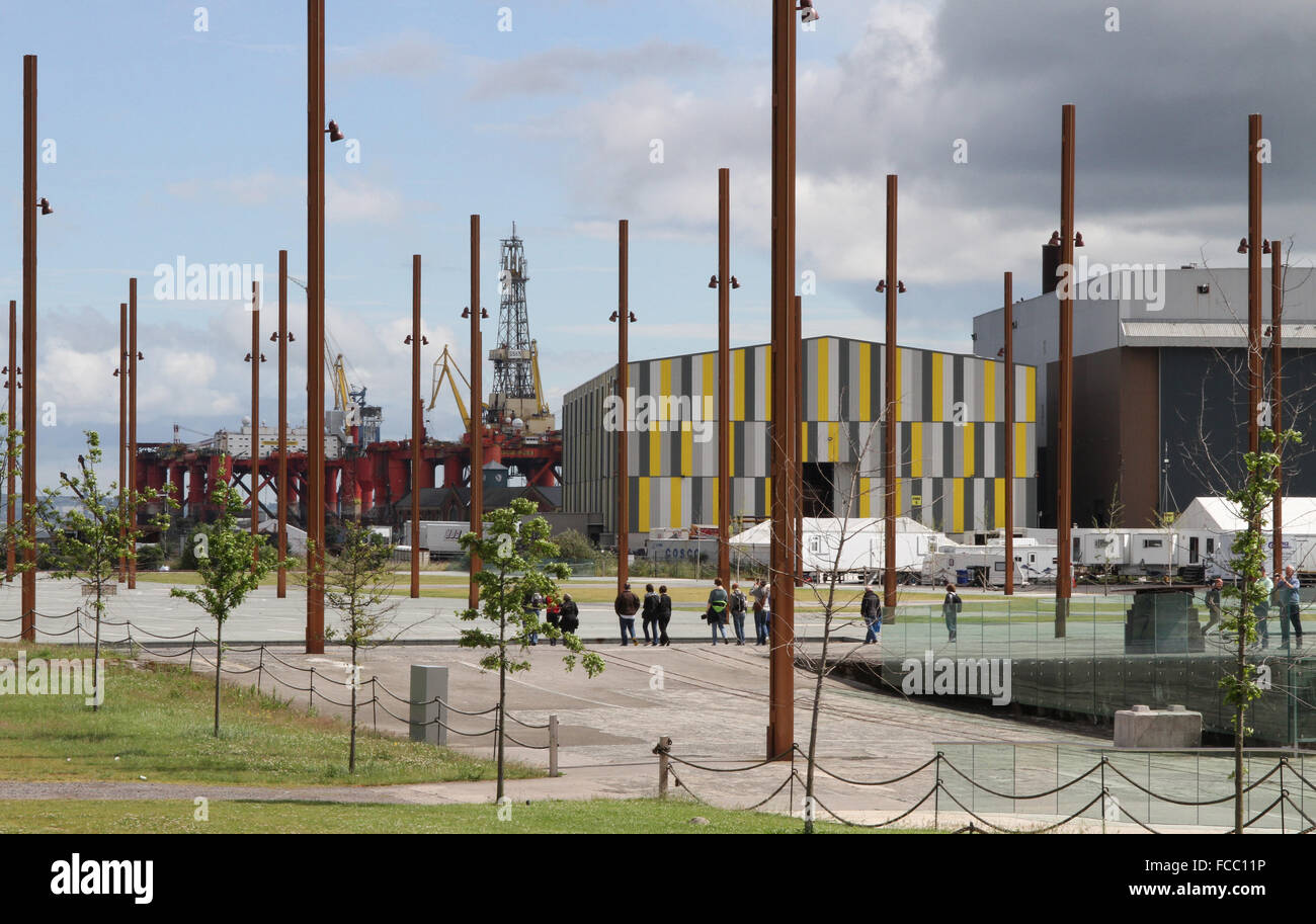 Tourists walk on the site of the Titanic slipway at Belfast Harbour ...
