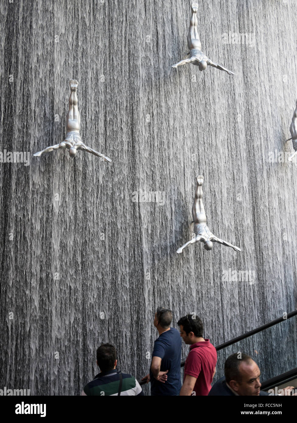 Waterfall and Human Diver Sculpture in Dubai Mall Stock Photo - Alamy