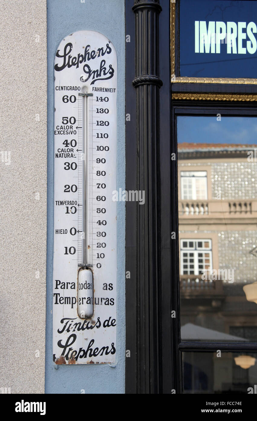 Vintage thermometer advertising Stephens Inks outside a shop in Porto ...