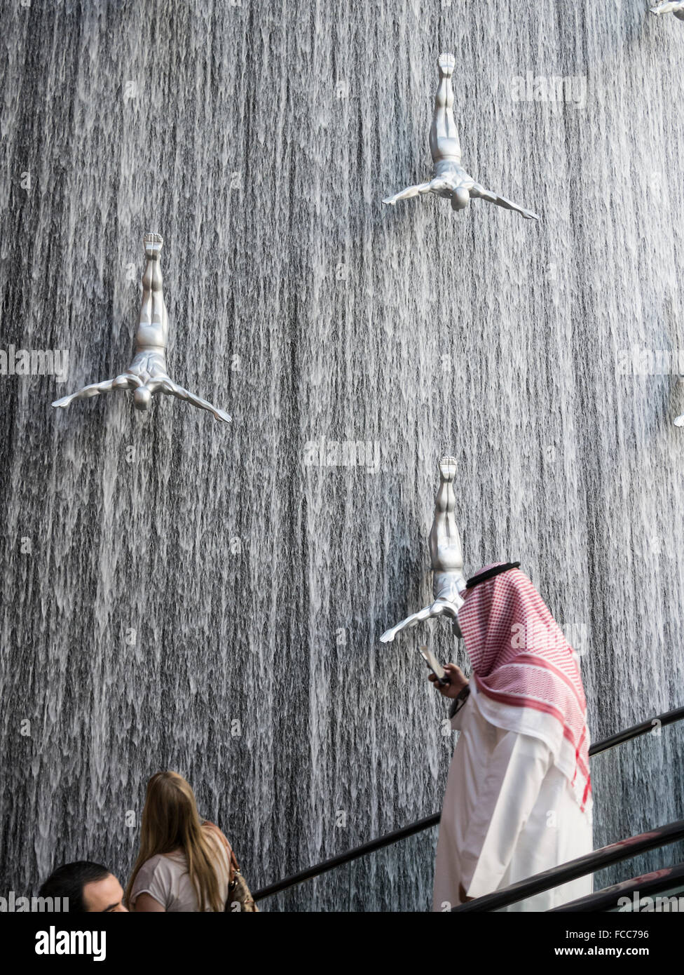 Waterfall and Human Diver Sculpture in Dubai Mall Stock Photo - Alamy