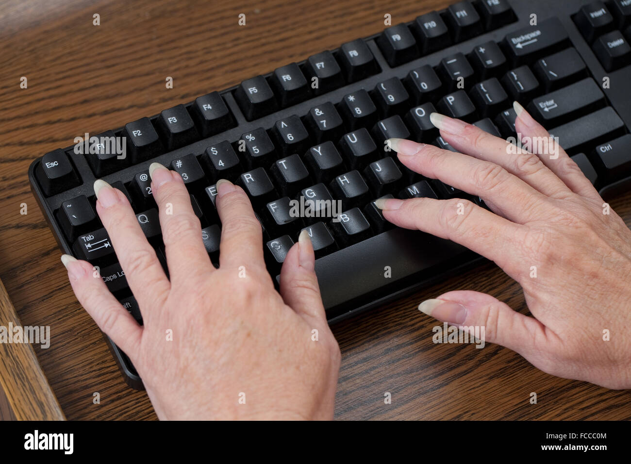 Typing on keyboard Stock Photo - Alamy