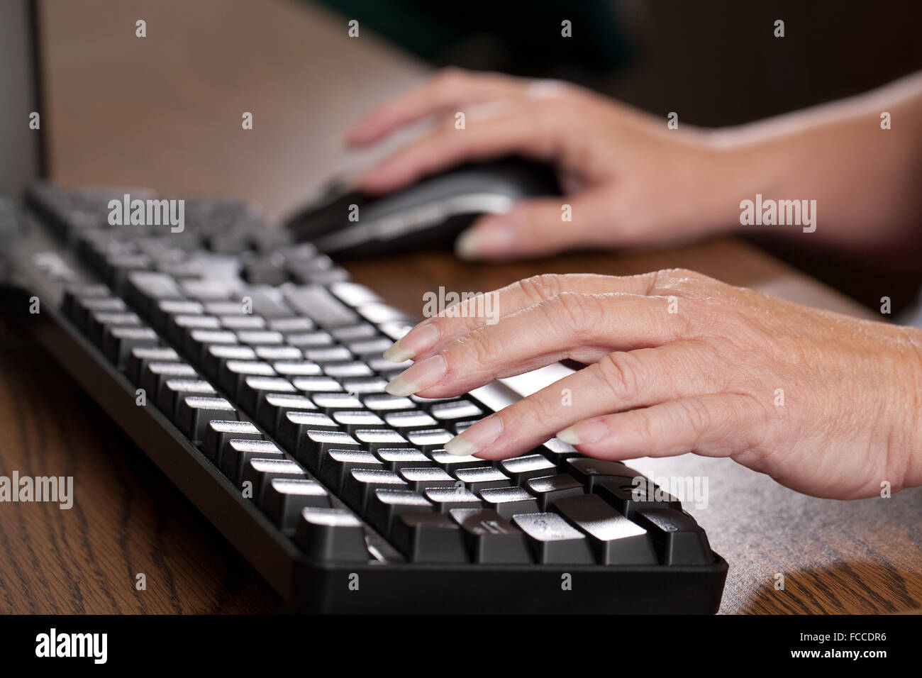 Typing on keyboard Stock Photo - Alamy