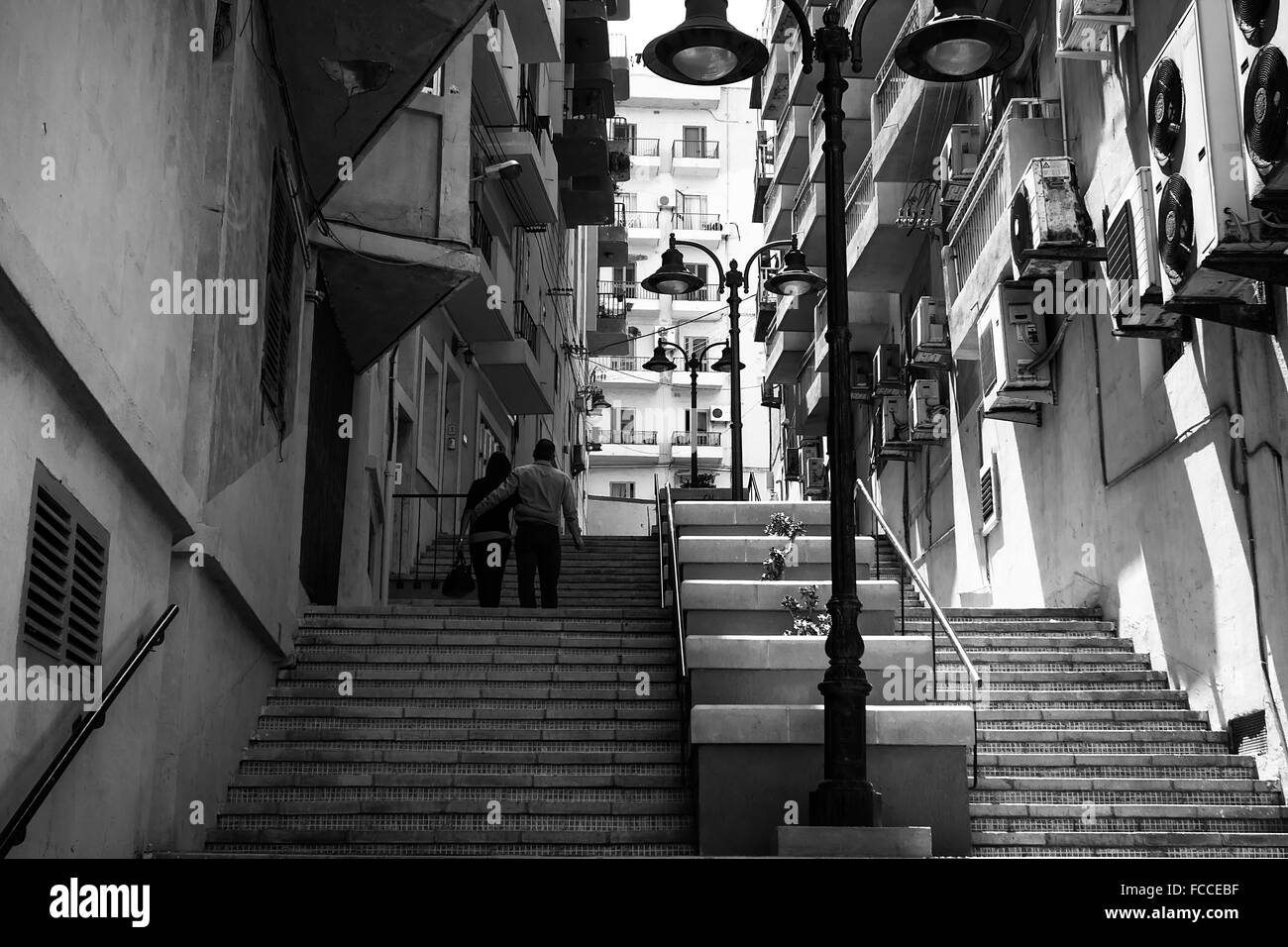 Two people walking up stairs hi-res stock photography and images - Alamy