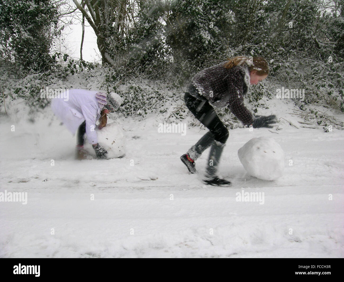 Rolling snowball snow hi-res stock photography and images - Alamy