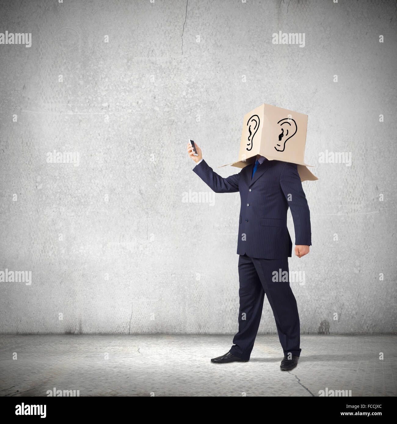 Troubled businessman with carton box on head expressing emotions Stock ...