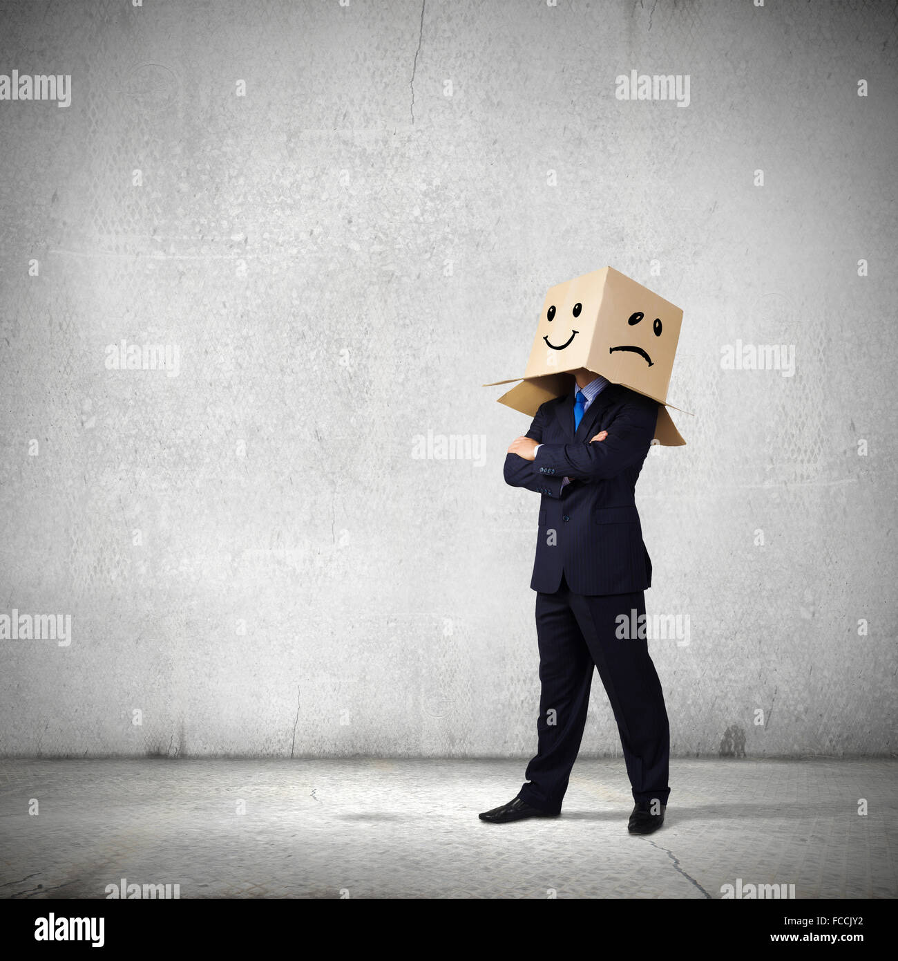 Businessman with box on head showing different emotions Stock Photo - Alamy
