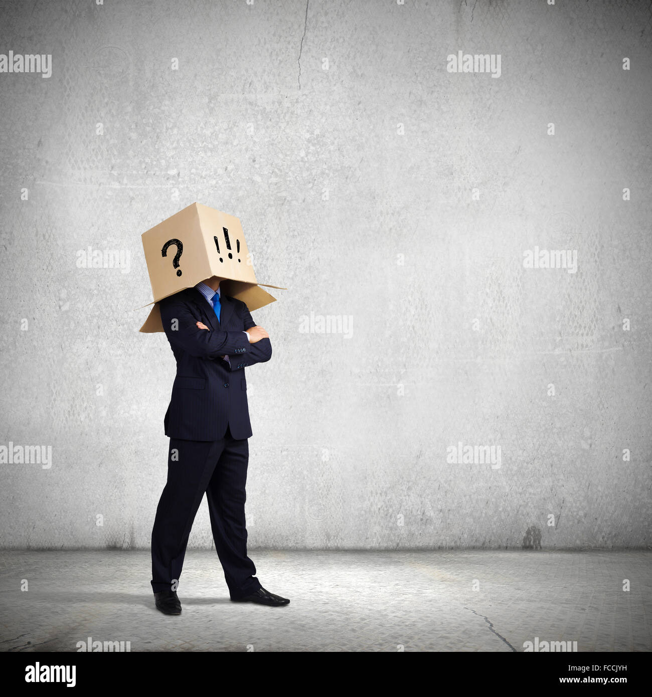 Businessman with box on head expressing emotions Stock Photo - Alamy