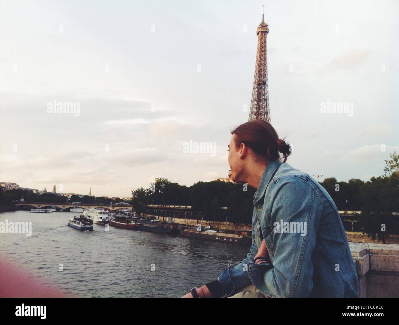 Man Viewing River Against Eiffel Tower Stock Photo - Alamy