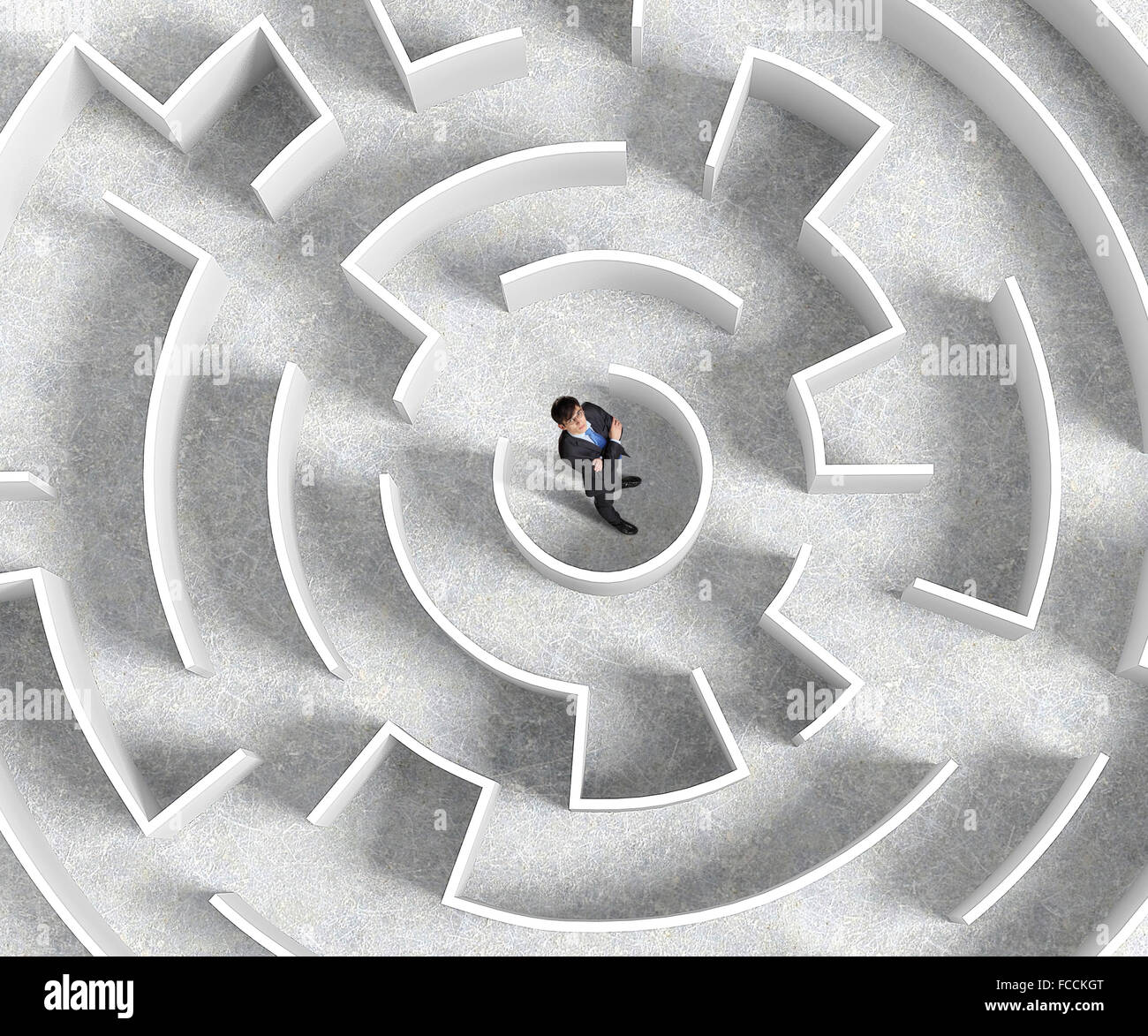 Top view of businessman standing in center of labyrinth hi-res stock ...